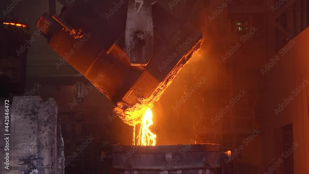 Tank pours liquid metal at the steel mill. Liquid metal from blast ...