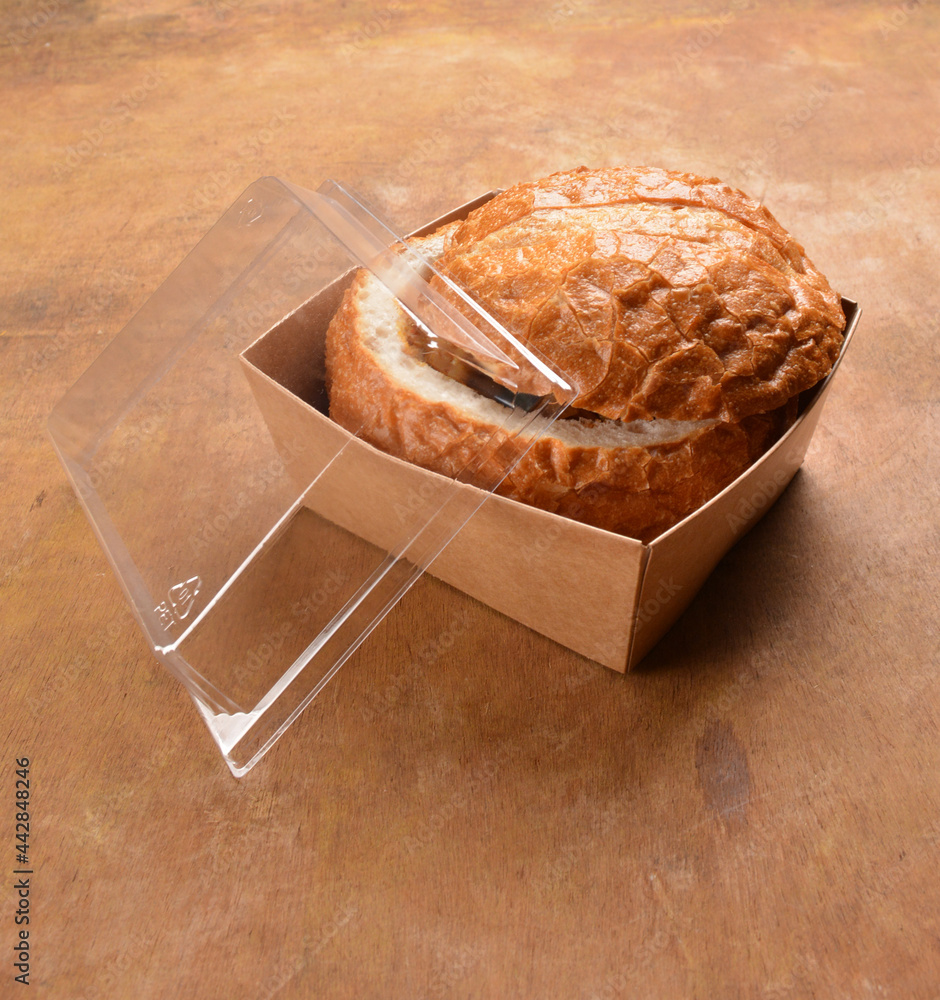 freshly bake big round bread bun with curry meat in bento box packaging ...