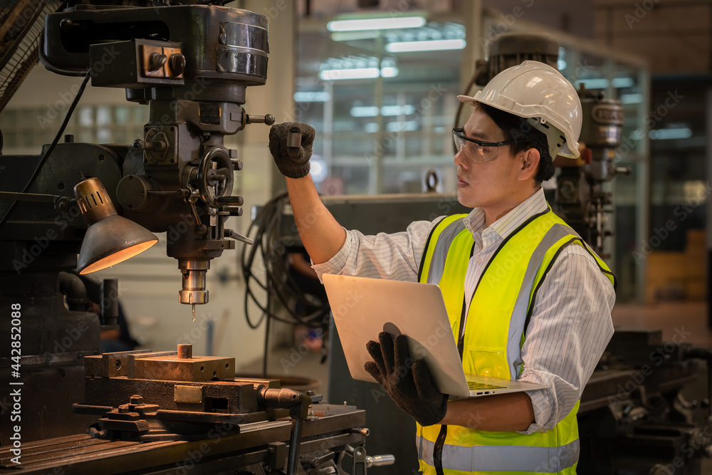 The Industry engineering wearing safety uniform control operating lathe ...