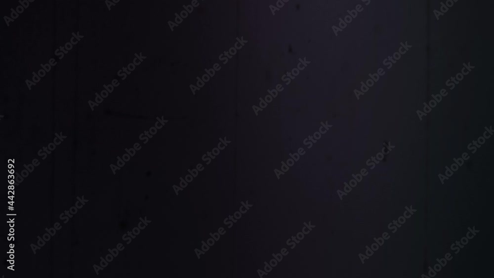 Colorful shiny sparkling particles move in a viscous liquid. It is ...