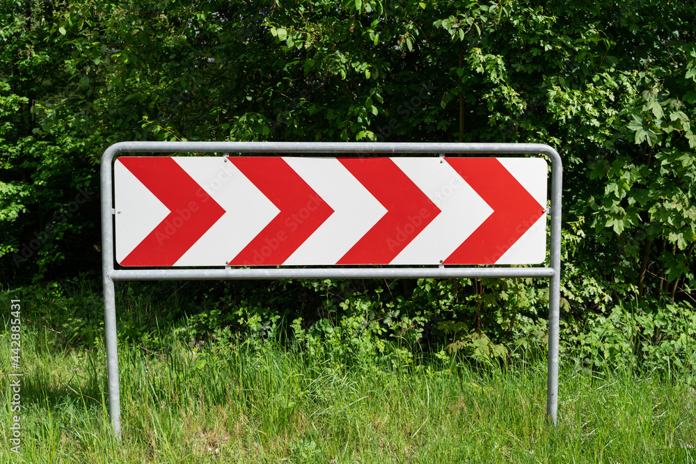 Road sign with red arrows pointing to the right Stock Photo | Adobe Stock