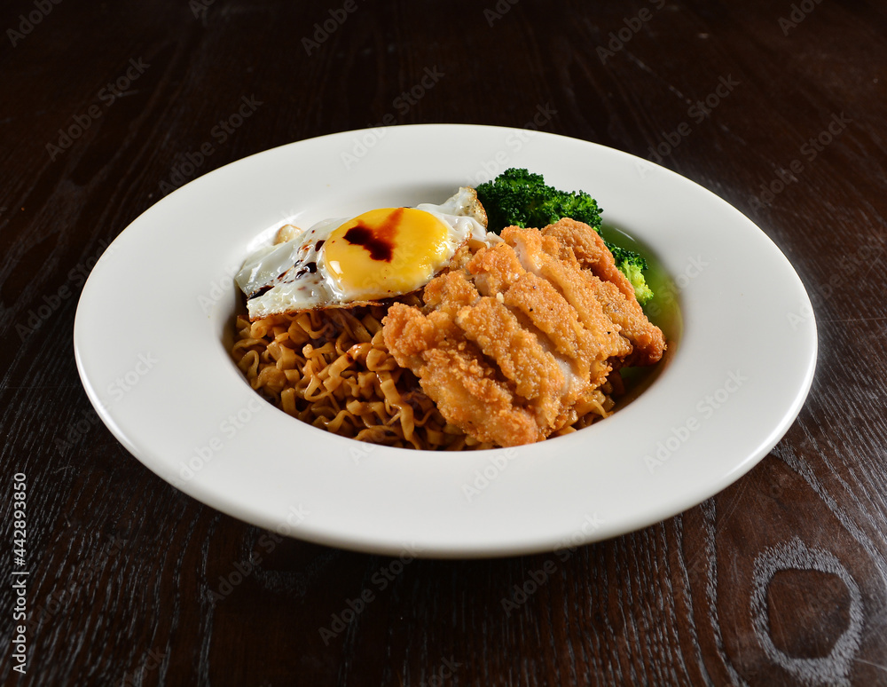 stir fried dry instant noodle mee indo in dark soya sauce with fried ...