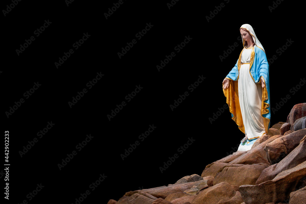 Statues of Holy Women on piles of limestone rocks isolated on black ...