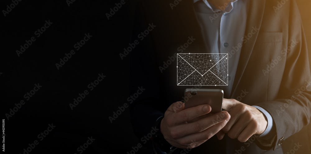 Businessman hand holding e-mail icon, Contact us by newsletter email ...