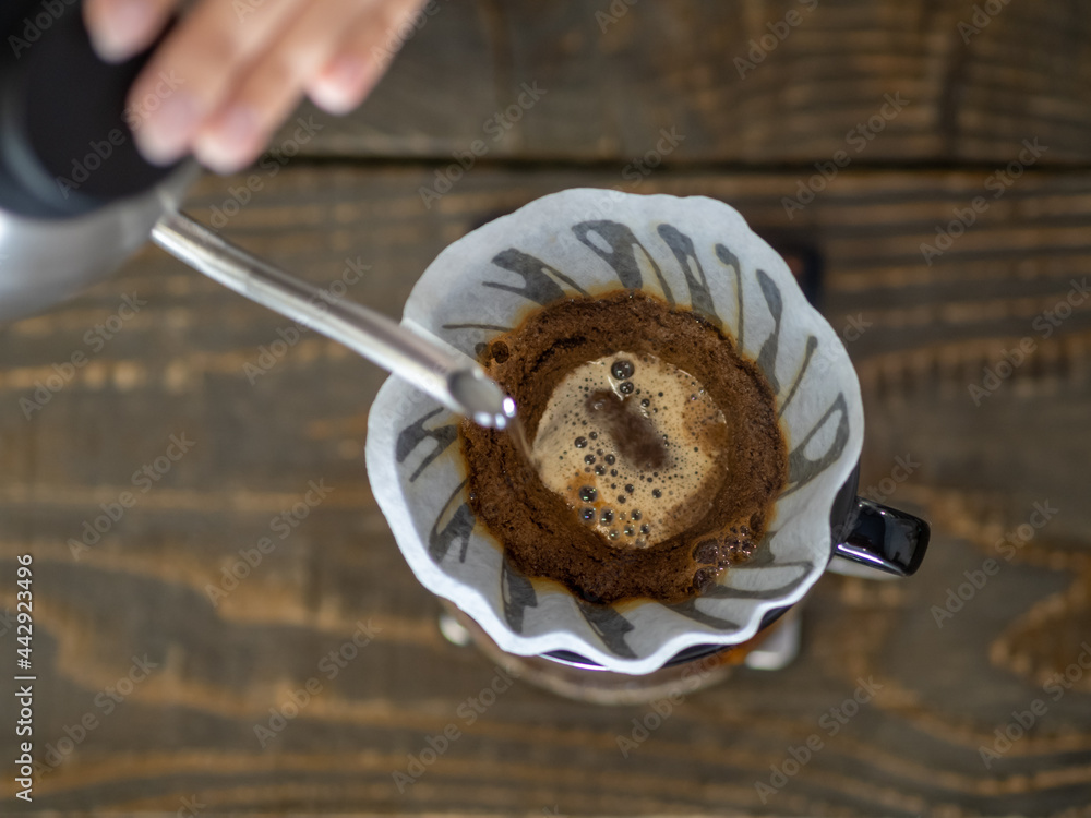 The process of brewing special coffee. Brewing coffee in a funnel. v-60 ...