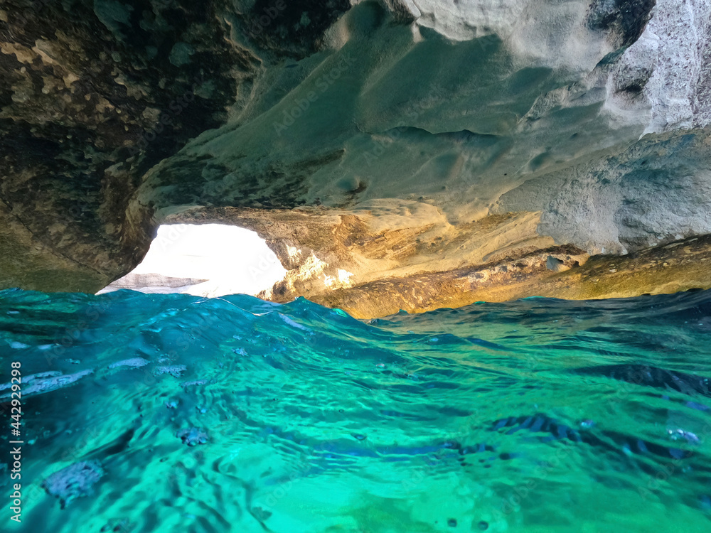 Underwater sea level split photo of iconic caves of Sarakiniko a ...