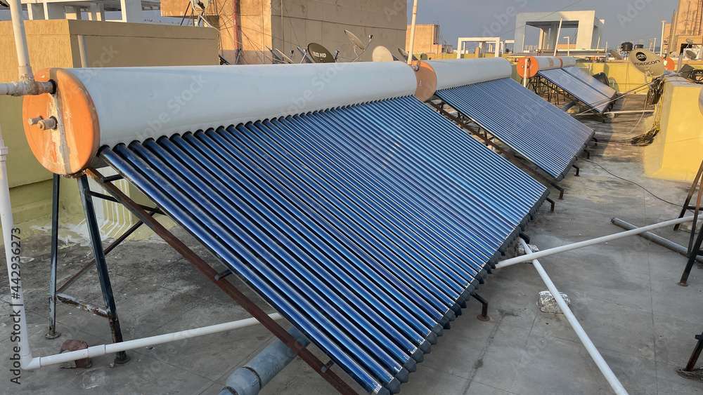 Solar panel tubes installed on roof tops to conserve energy and as ...