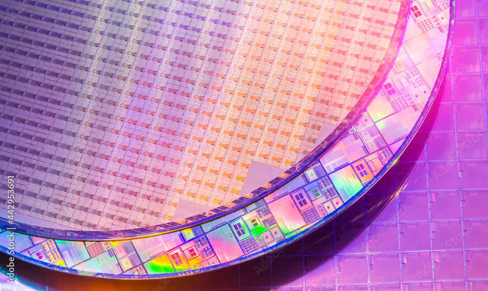 silicon wafer reflecting different colors. Stock Photo | Adobe Stock