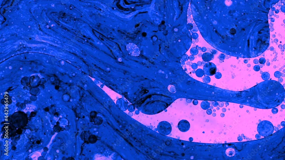 Colorful oil drops floating on water surface, top view. Fantastic ...