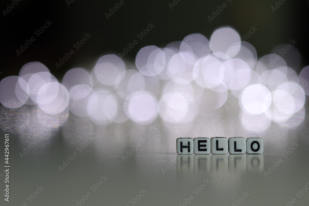 HELLO text on white cubic blocks. The letters are written on the cubes ...