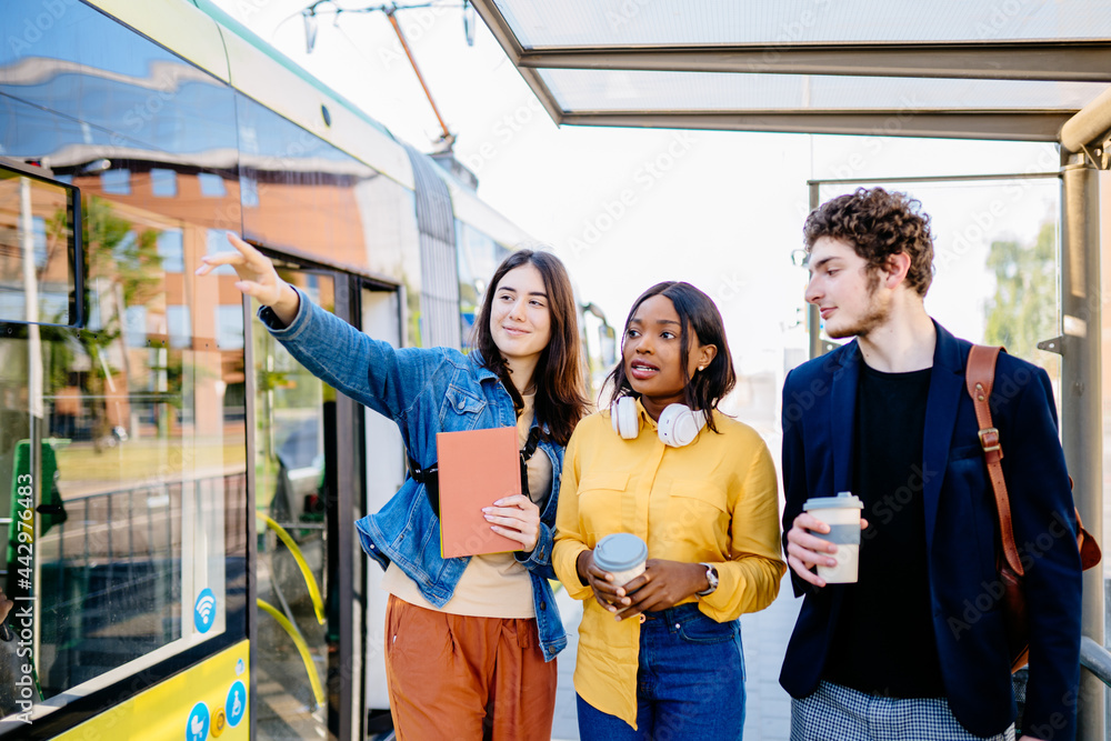 African american female traveler asking for help woman with at tram ... African american female traveler asking for help woman with at tram ...