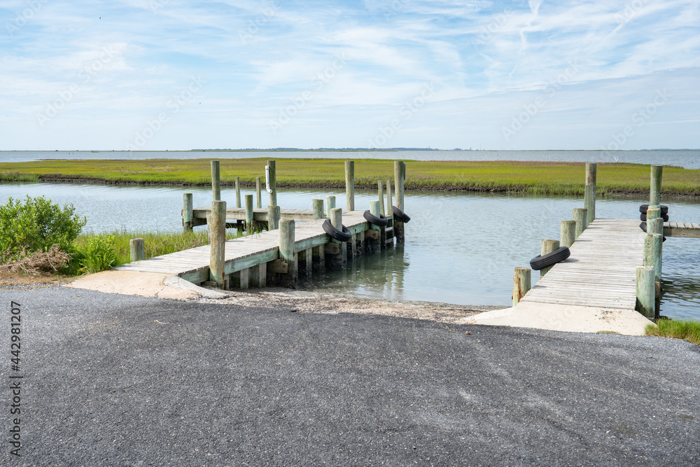 Roadside public boat launch ramp from asphalt to shallow brackish ...