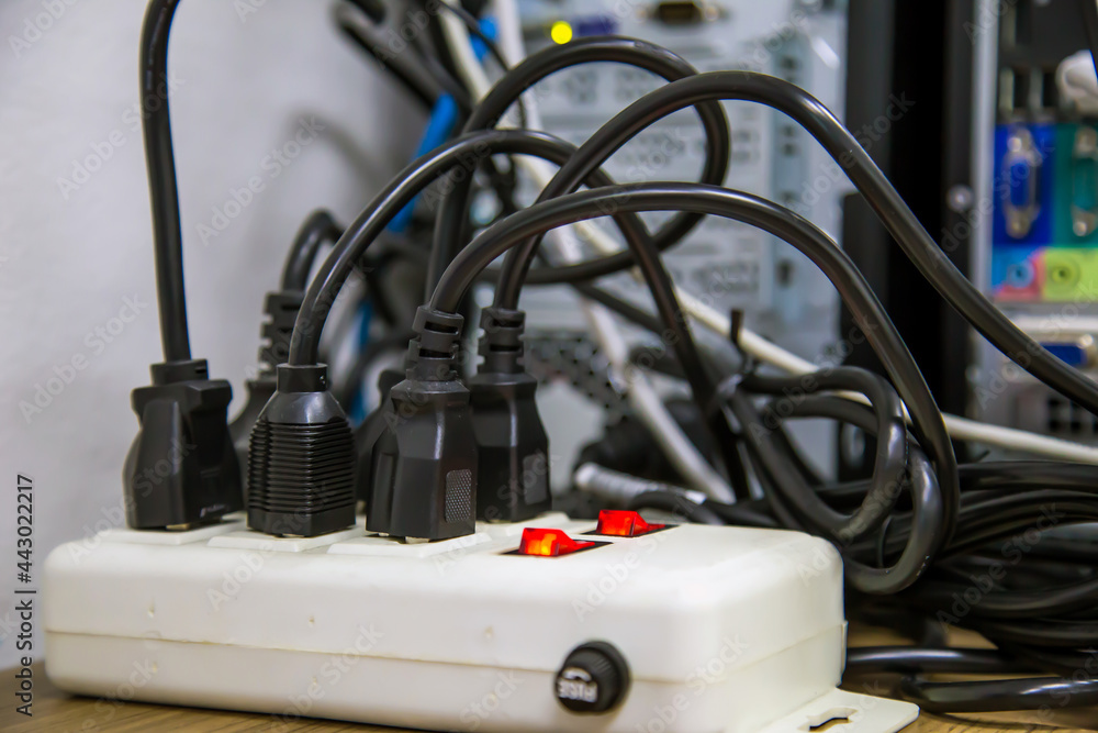 Old and damaged electric adapter power plug has many appliances are ...