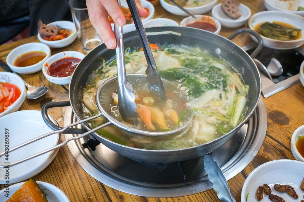 Korean food: Galmi Shabu Shabu with fresh raw Surf clam, kimchi, side ...