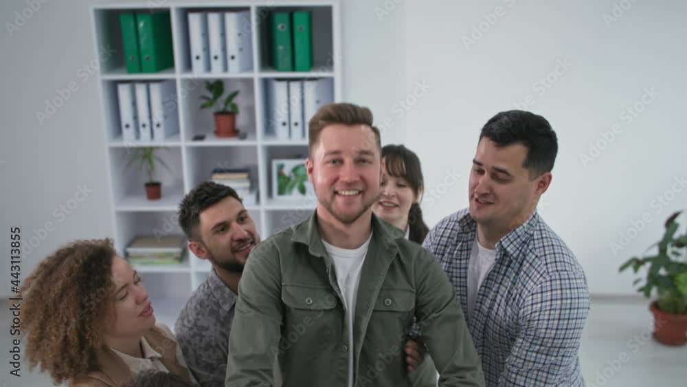 trust fall, happy man falls back into arms of his male and female team ...
