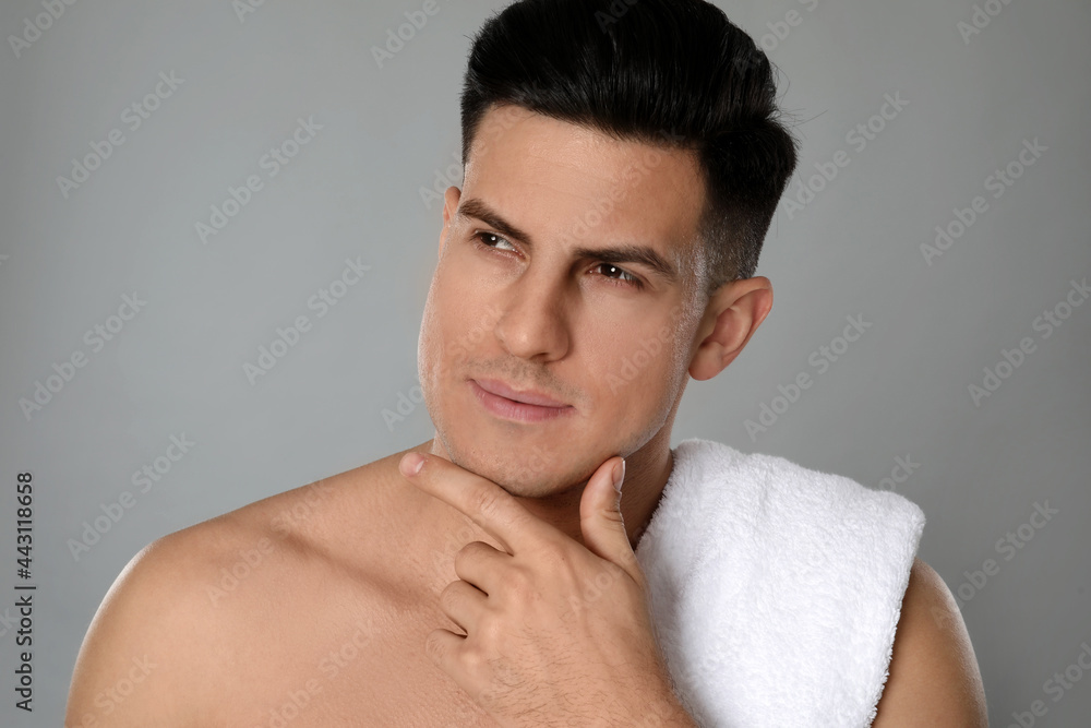 Handsome man after shaving on grey background Stock Photo | Adobe Stock