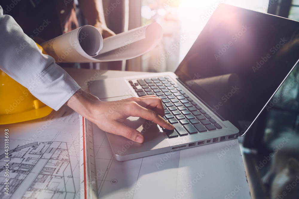 Two colleagues discussing data working and tablet, laptop with on on ...