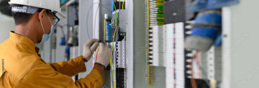 Electrician engineer using digital multimeter test current electric in ...