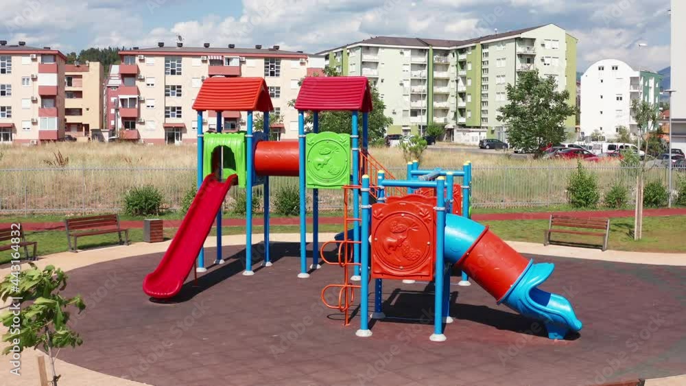 Empty playhouse and slide in a playground for kids. Deserted ...