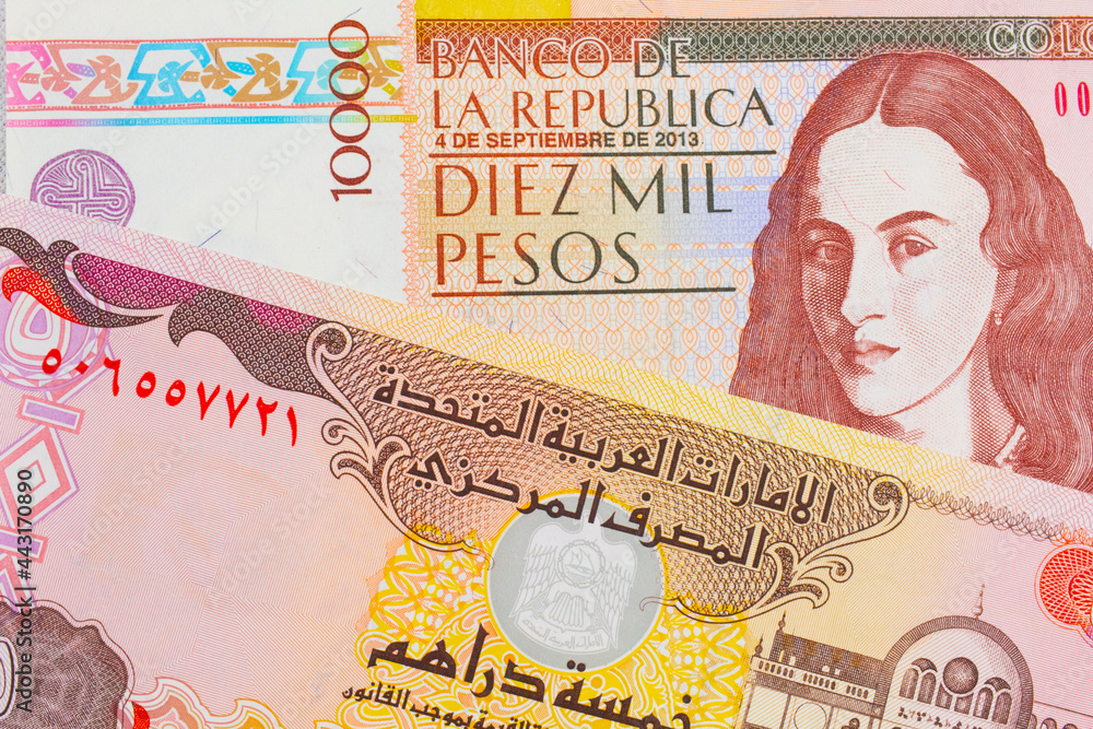A macro image of a brown ten thousand bank note from Colombia paired up ...