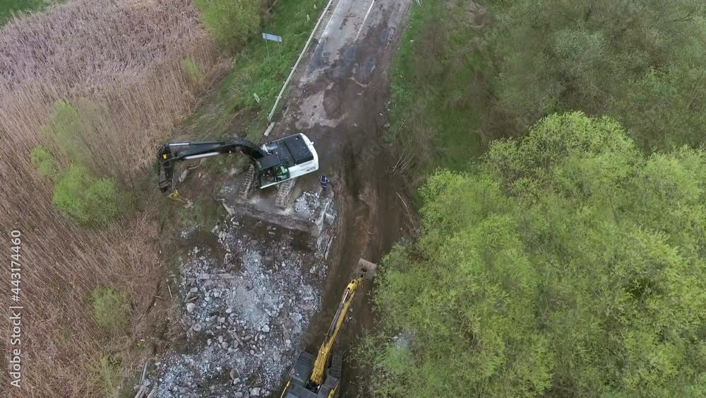 Broken bridge, crawler excavator at rivers broken road structure ...