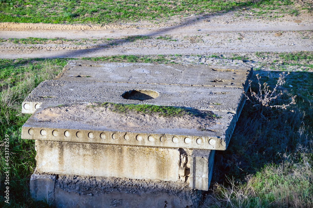 Concrete underground structure covered with a slab with a hole for the ...