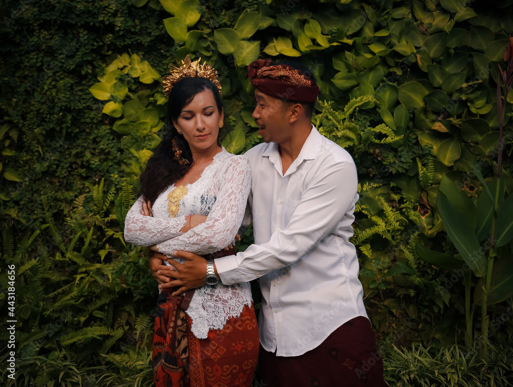 Balinese culture. Multicultural couple wearing traditional Balinese ...