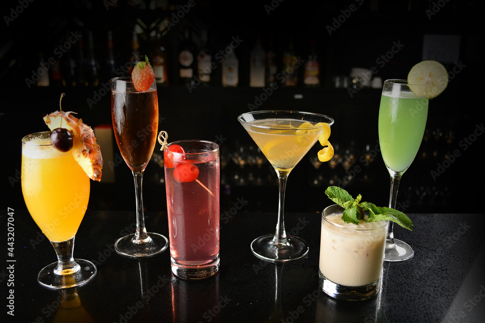 bartender make special cold cocktail or mocktail in tall glass goblet ...