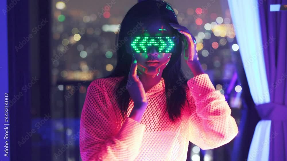 Neon asian woman dancing. Fashion model woman in neon light, portrait ...