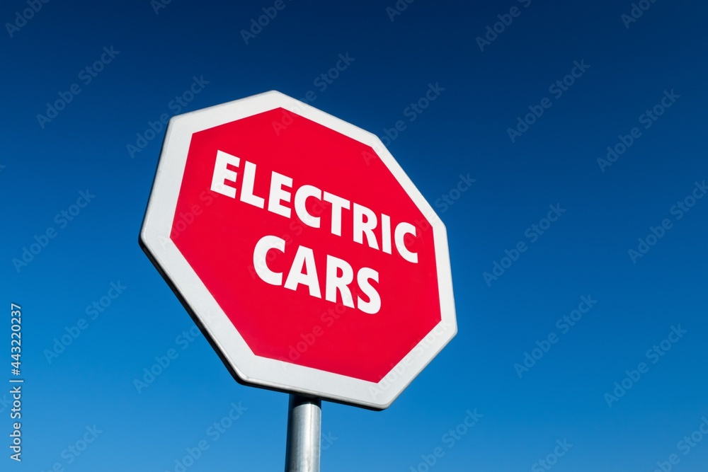Stop sign with ELECTRIC CARS text to abandon controversial EVs as a ...