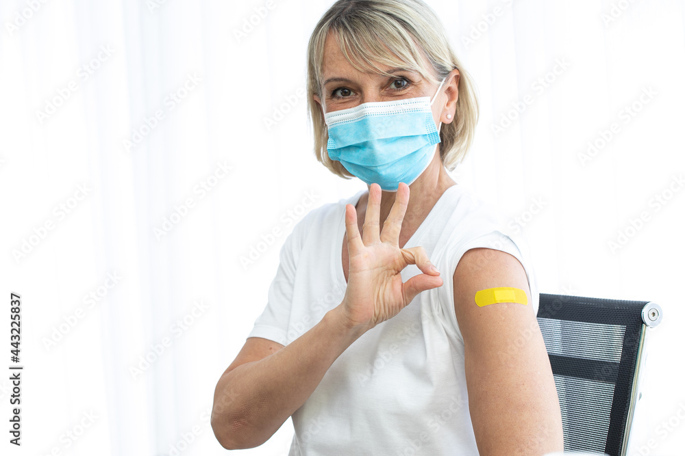 Happy senior woman after recieve covid -19 vaccine injection. Stock ...
