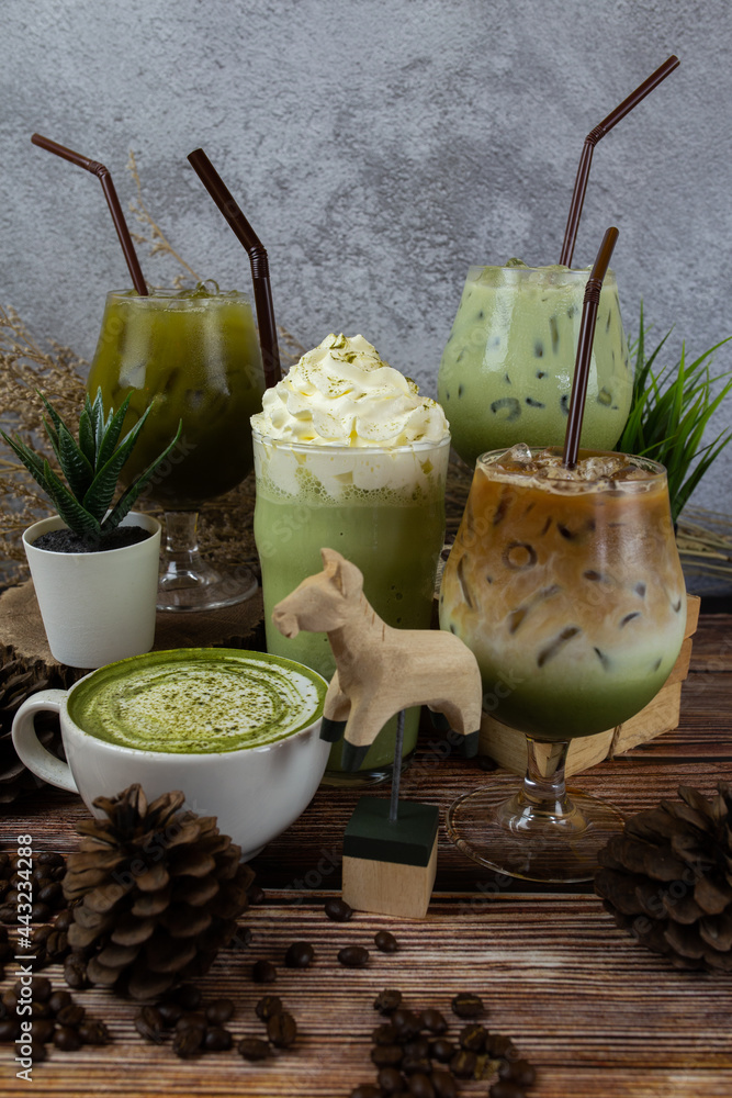 Fresh milk green tea menu is placed on a wooden table. The background ...