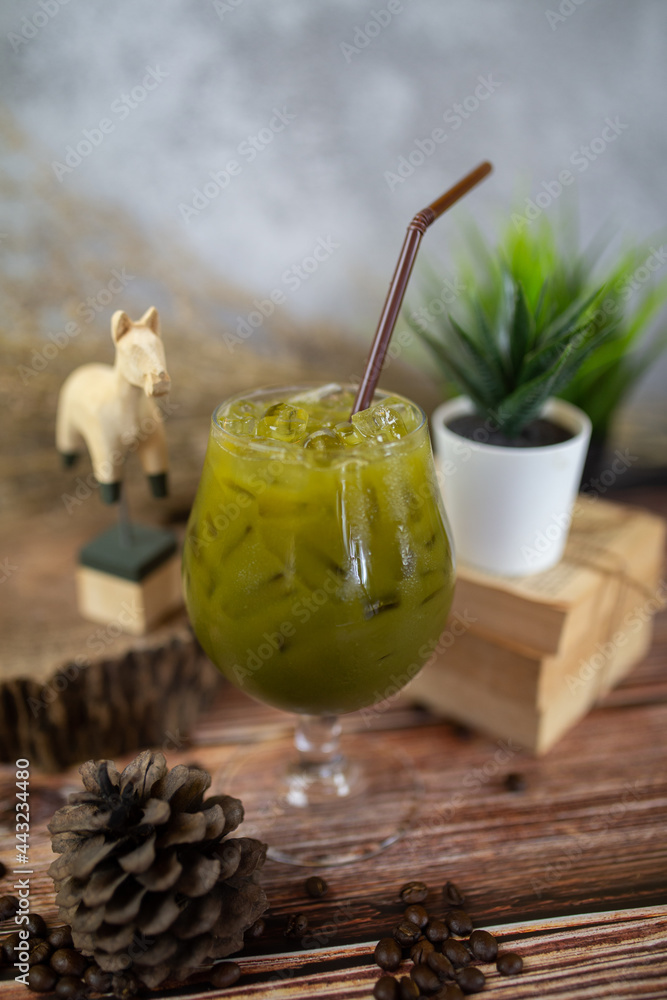 Fresh milk green tea menu is placed on a wooden table. The background ...