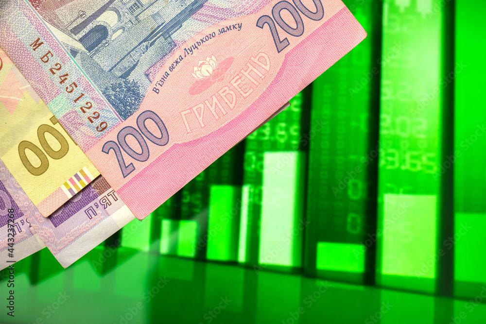 Ukrainian currency growth up, background hryvnia banknotes and green ...