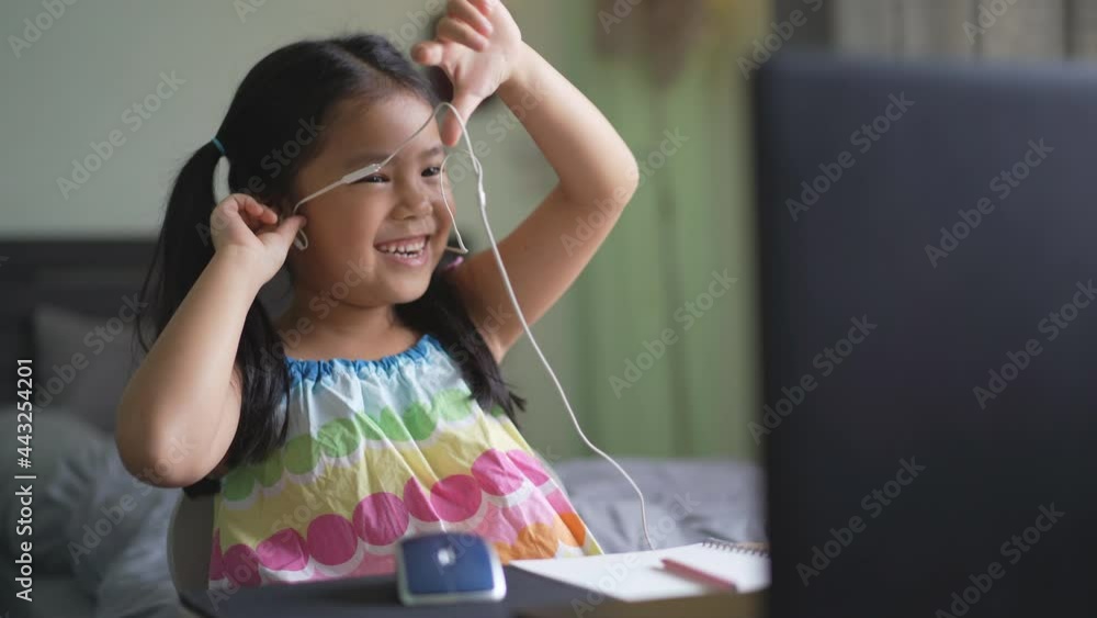 Asian child or kid girl smile enjoy e-learning and speak to small talk ...