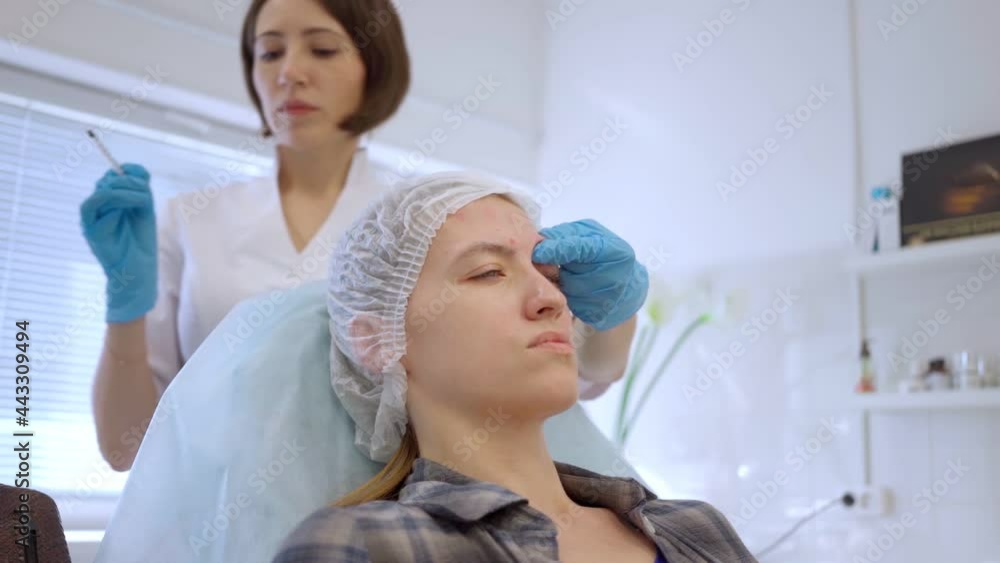 girl injected with botulin into skin of face. rejuvenating procedure in ...