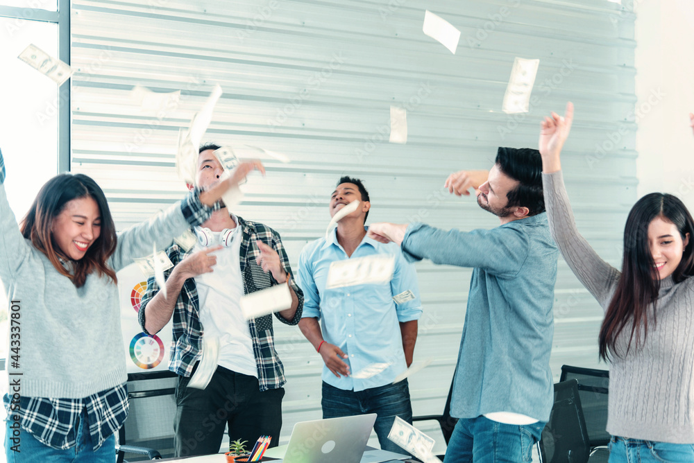 Happy business people holding dollar money and throw in the air ...