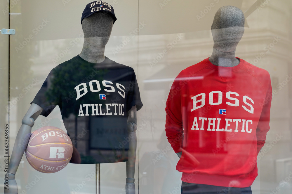 Hugo Boss logo text on windows shop sign and brand store boutique ...