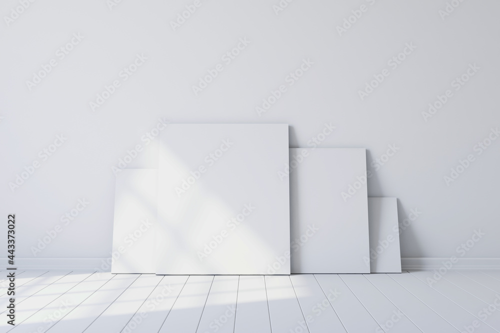 Blank canvases of paintings in an empty white room. 3d rendering Stock ...