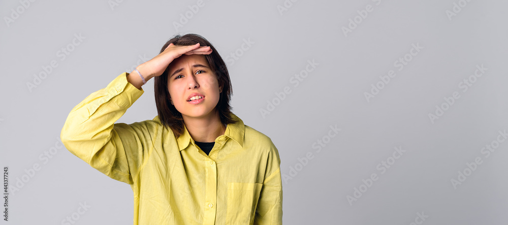 Young beautiful teen girl looking far away with hand over head ...