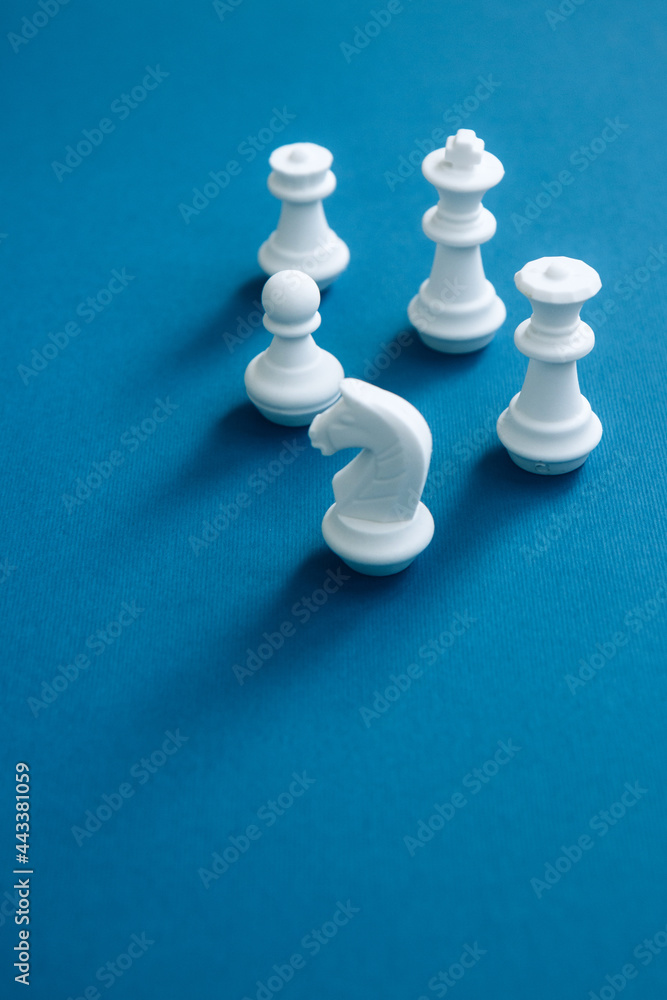 Chess pieces on a bright blue background. Abstract background. White ...