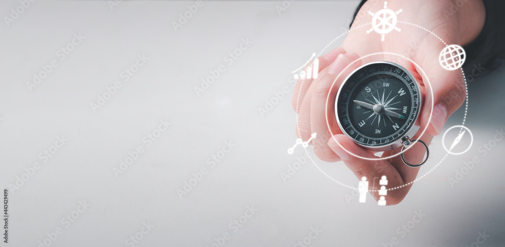 Business navigate concept, Businessman holding compass navigation for ...