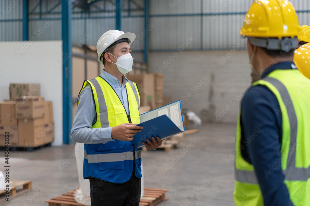 Asian male supervisor engineer in wearing helmet safety and hygienic ...