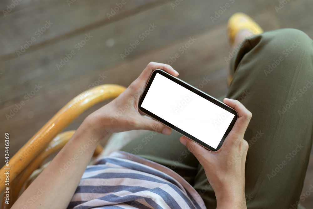Close up back rear view of young asian female with phone on white blank ...