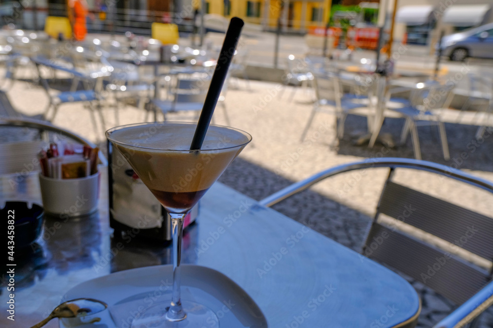 Ice coffee, cafe shakerato in glass close-up on the table across ...