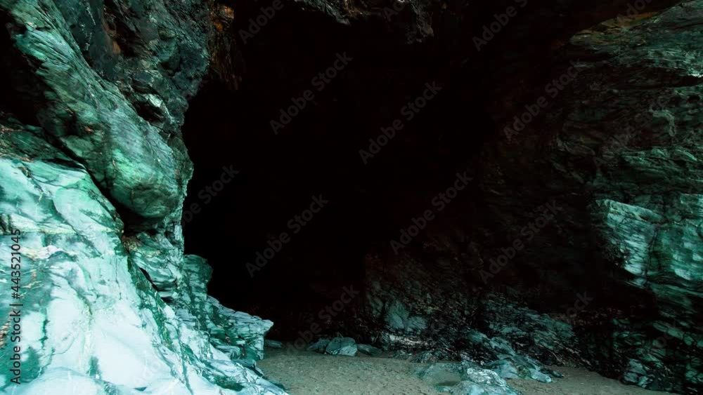 Entering into a dark terrifying cave in Tintagel Castle, Cornwall ...