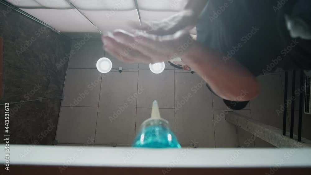 Low angle view shot on loft ceiling background, Man with face mask is ...