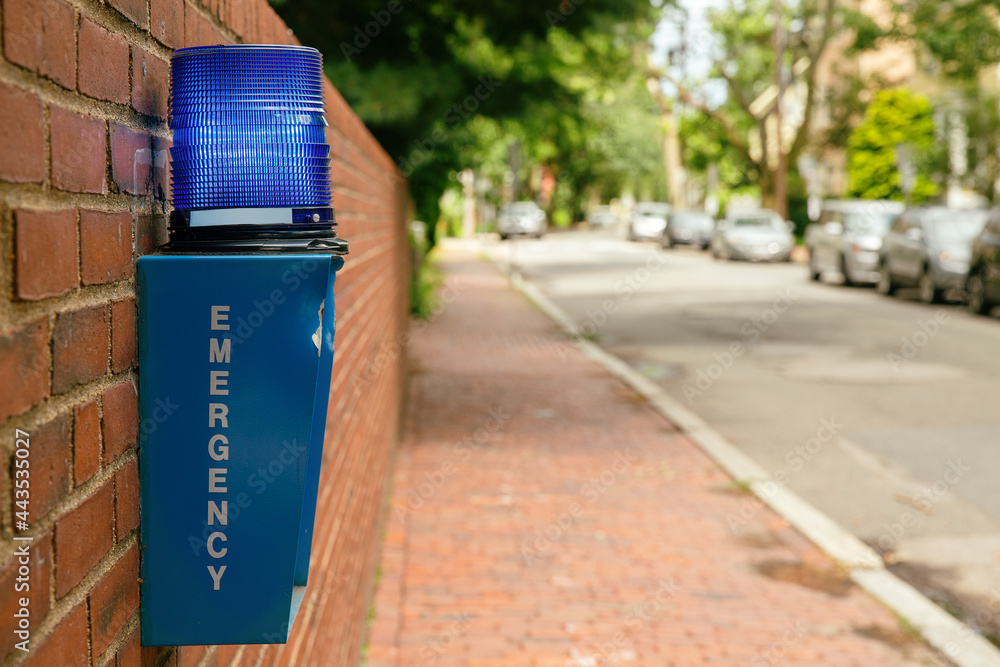 Emergency button outdoor in the city street. Blue box with alarm system ...