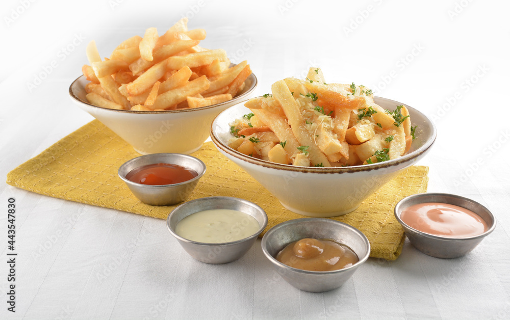 deep fried golden French fries with parmesan cheesy sauce in white ...