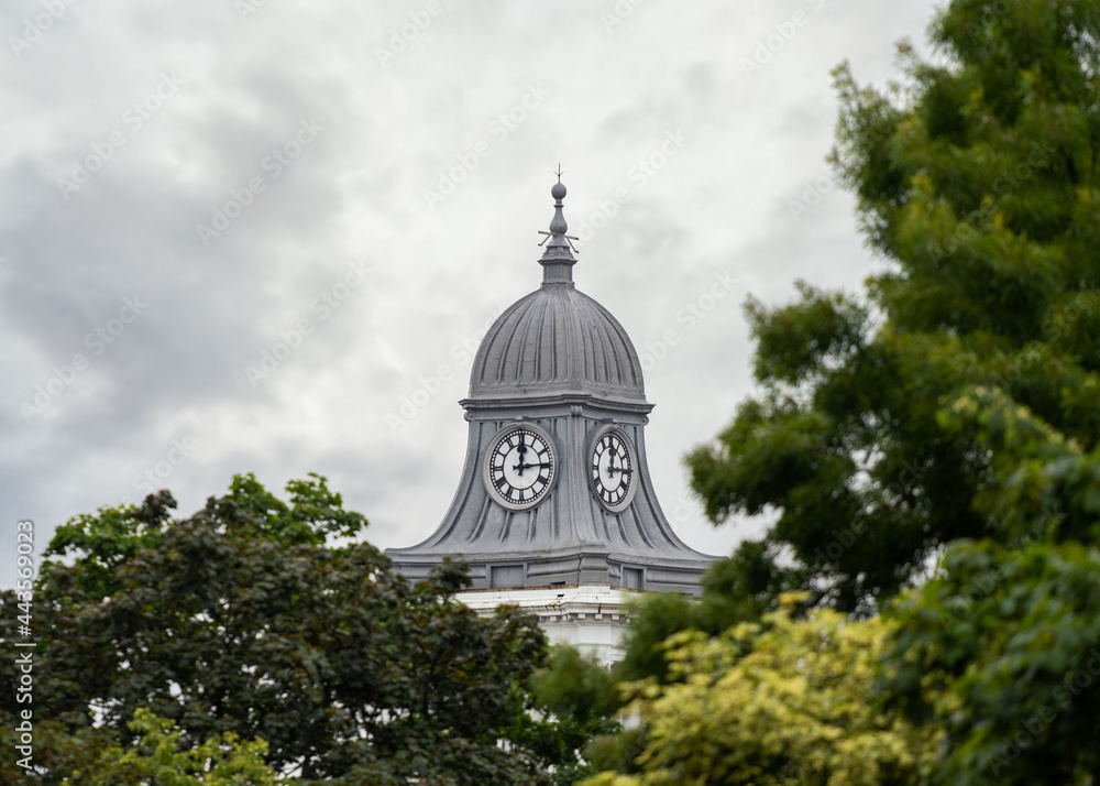 Old clock tower with dome on top clock face showing 12:15 quarter past ...